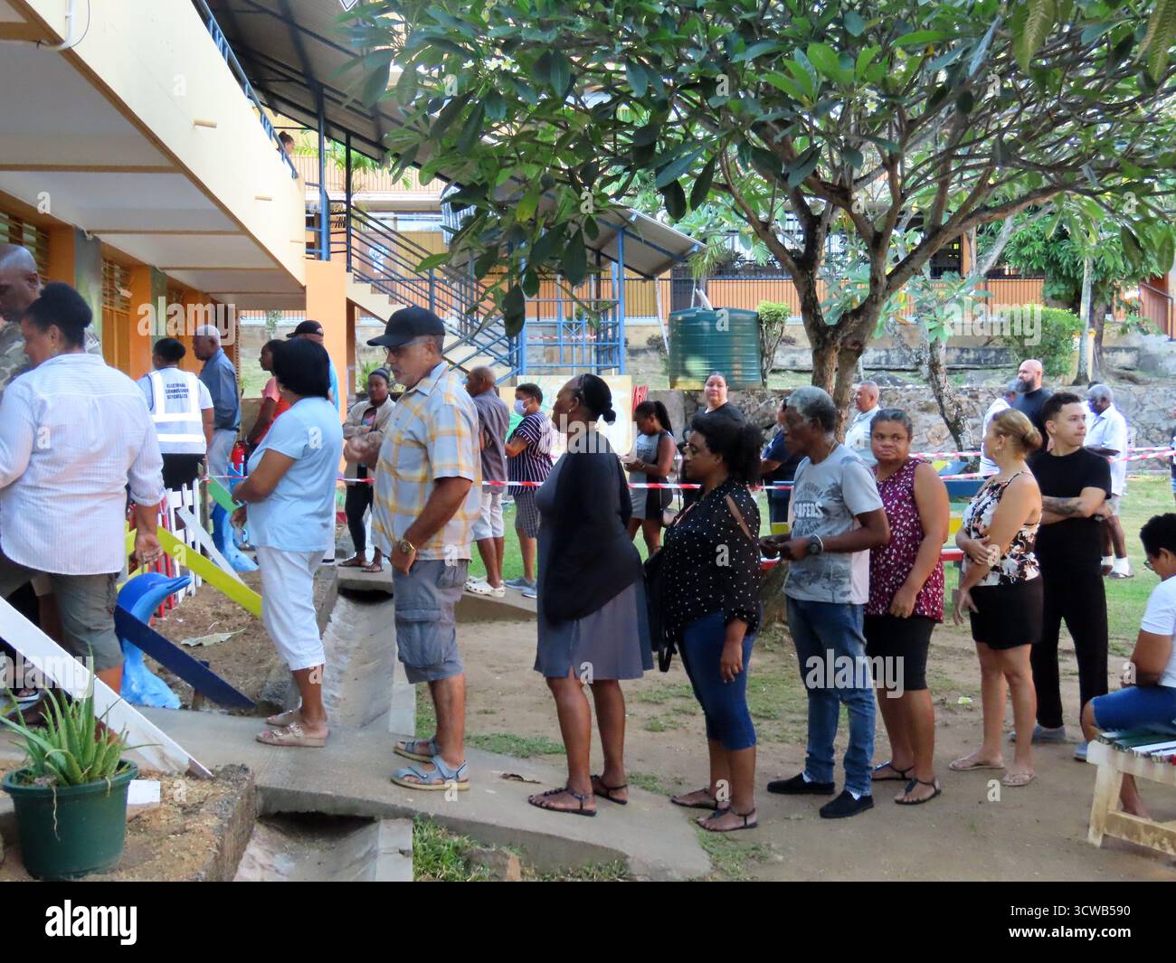 People line up to cast their votes in a runoff presidential election at ...
