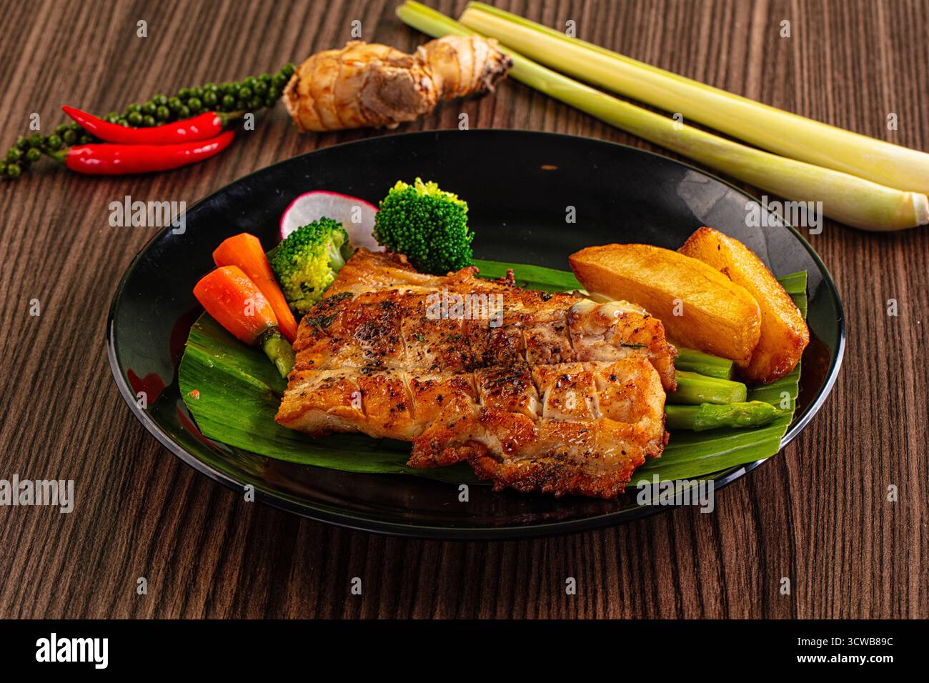 Gourmet asian Grilled crocodile steak served potato and asparagus Stock ...