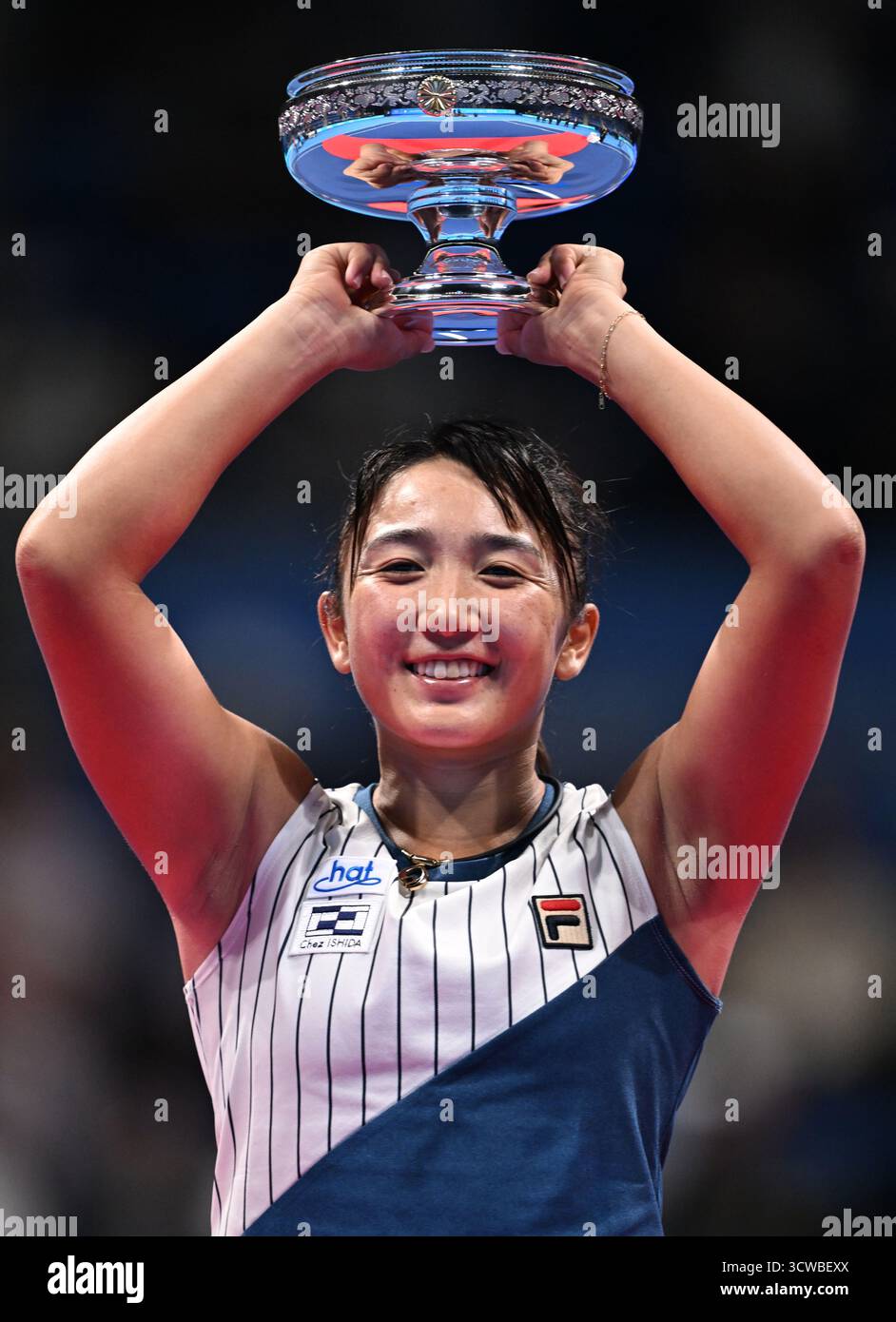Kyoka Okamura celebrates at an award ceremony after defeating Ayano ...