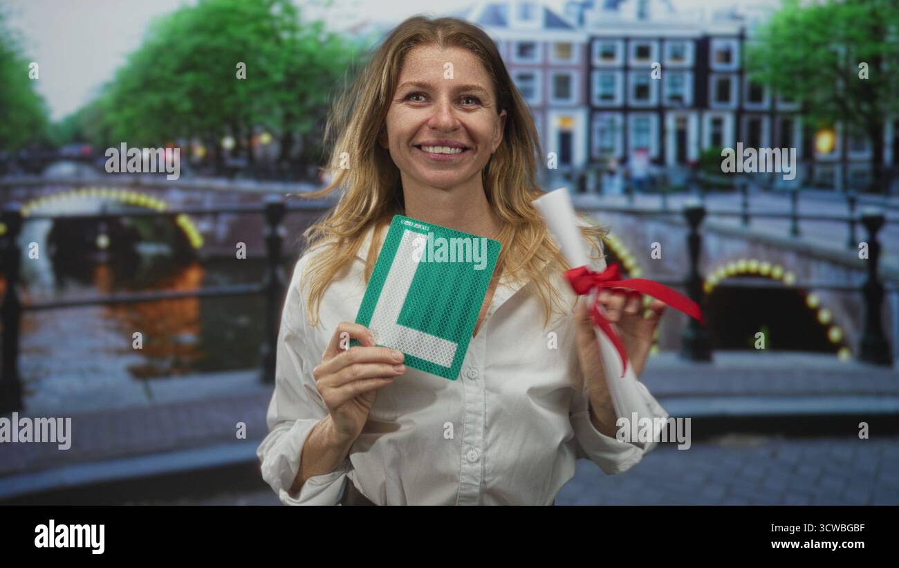 Woman smiles holding learner hi-res stock photography and images - Alamy