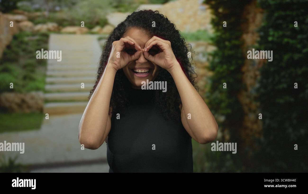 Woman framing fingers pointing hi-res stock photography and images - Alamy