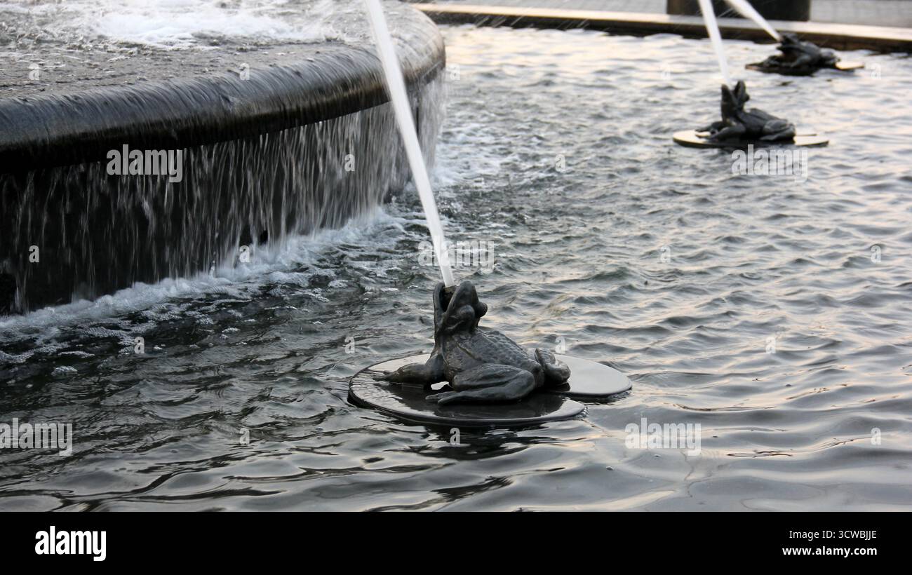 Tourny Fountain, frog-shaped bronze faucets spouting water into a pool ...