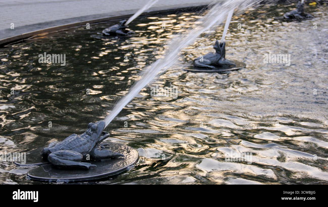 Tourny Fountain, frog-shaped bronze faucets spouting water into a pool ...