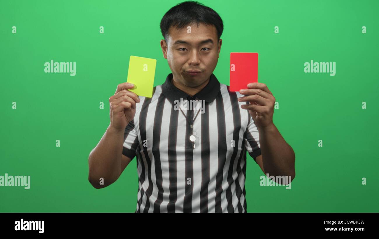 Man referee holds red yellow hi-res stock photography and images - Alamy