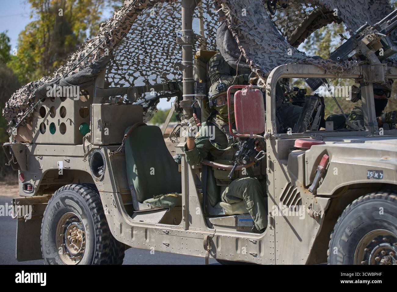 Israeli soldiers are seen near a military base ahead of the expected ...