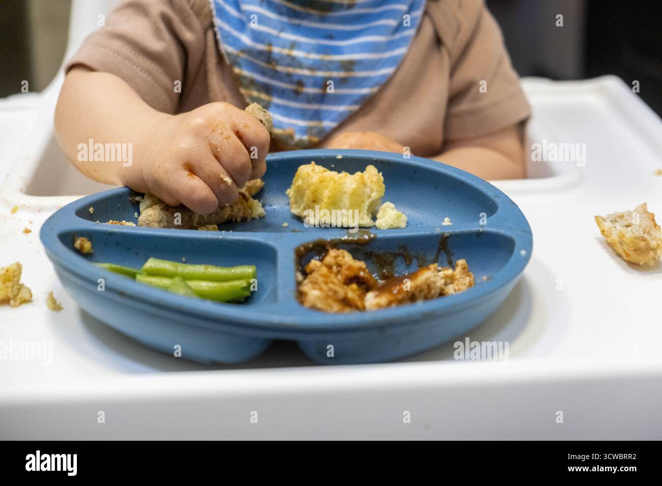 Infant toddler family eating table hi-res stock photography and images ...