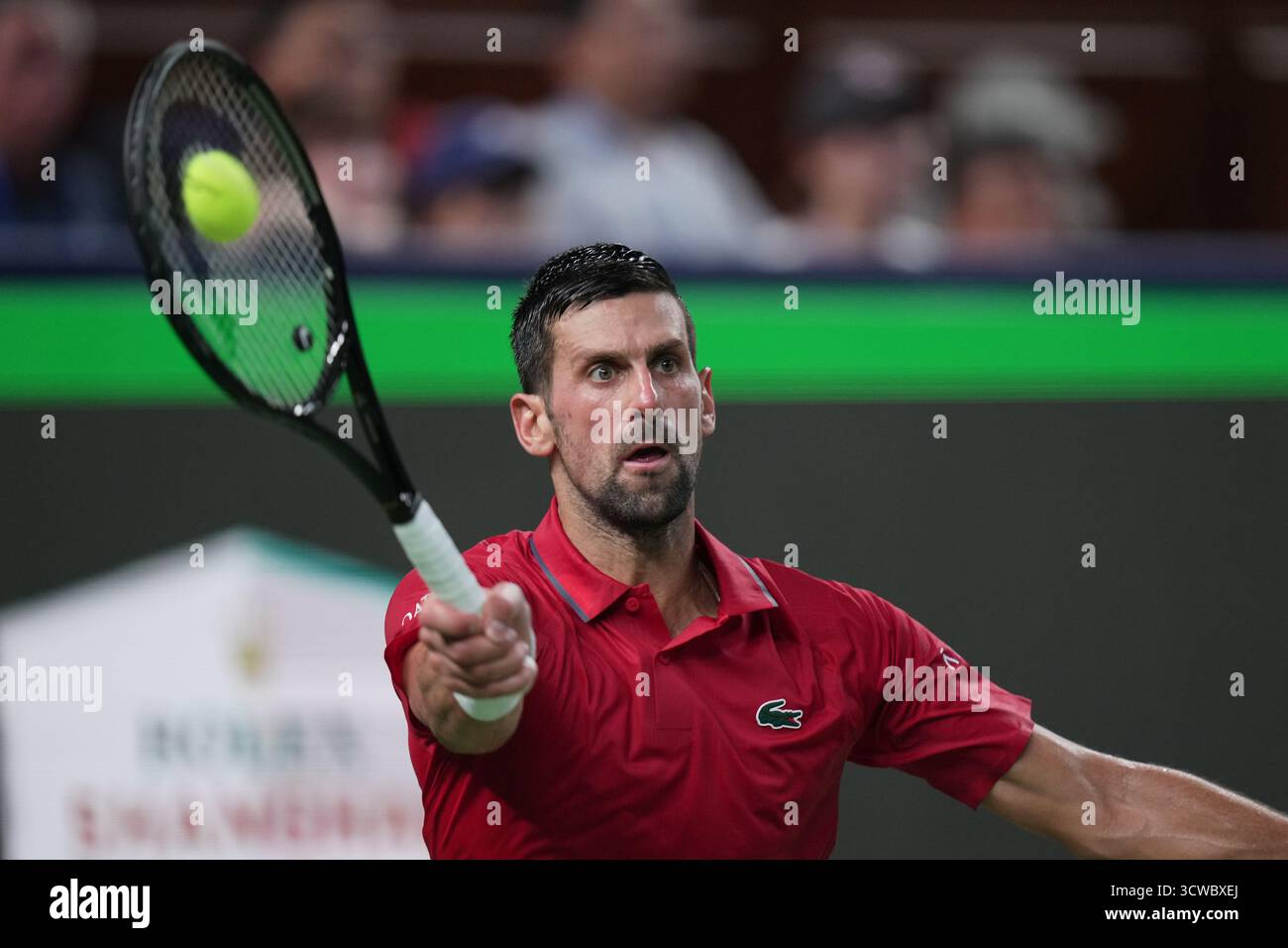 Novak Djokovic of Serbia plays a forehand return to Valentin Vacherot ...