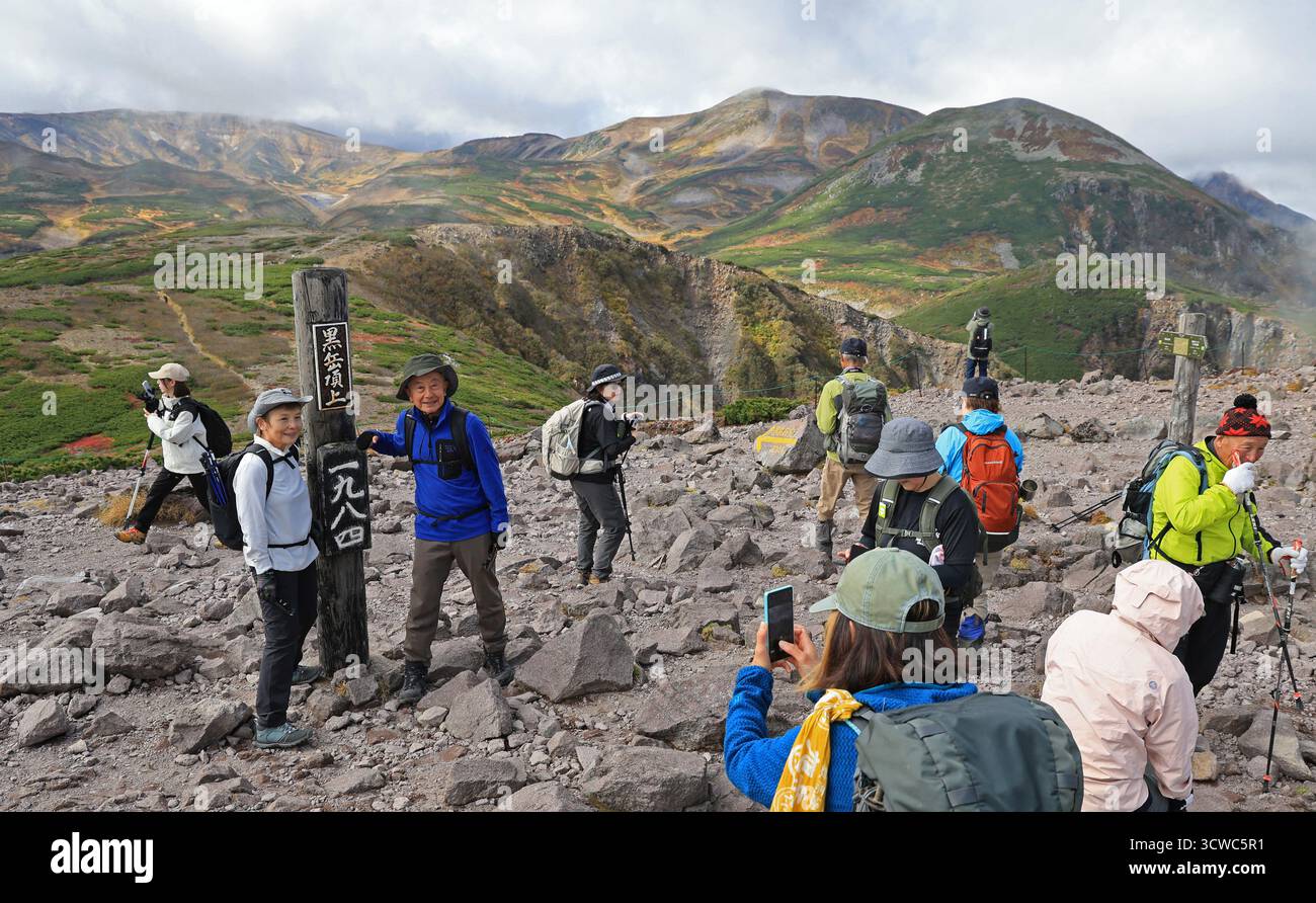 Climbers climb Mount Kurodake in Kamikawa Town, Hokkaido Prefecture ...