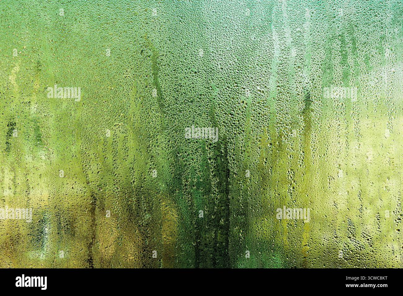 sheet of transparent window covered in moisture. wet glass background ...