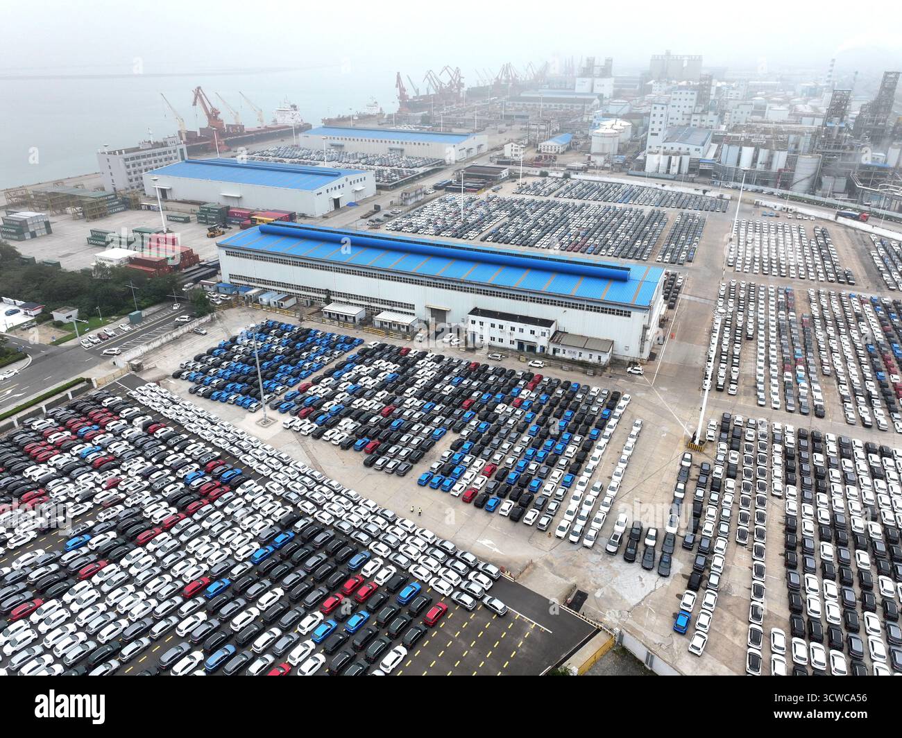 Aerial view of new cars waiting for shipment to overseas markets in a ...