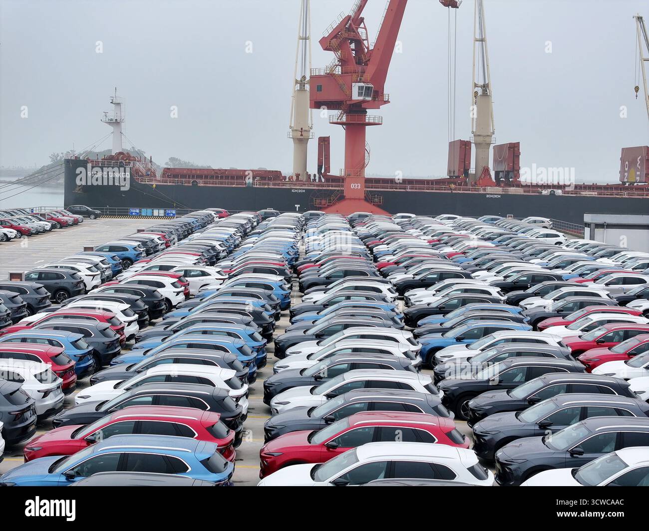 Aerial view of new cars waiting for shipment to overseas markets in a ...