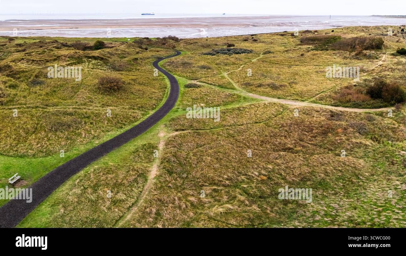 An aerial panorama of the Crosby Coastal Path veering through the ...