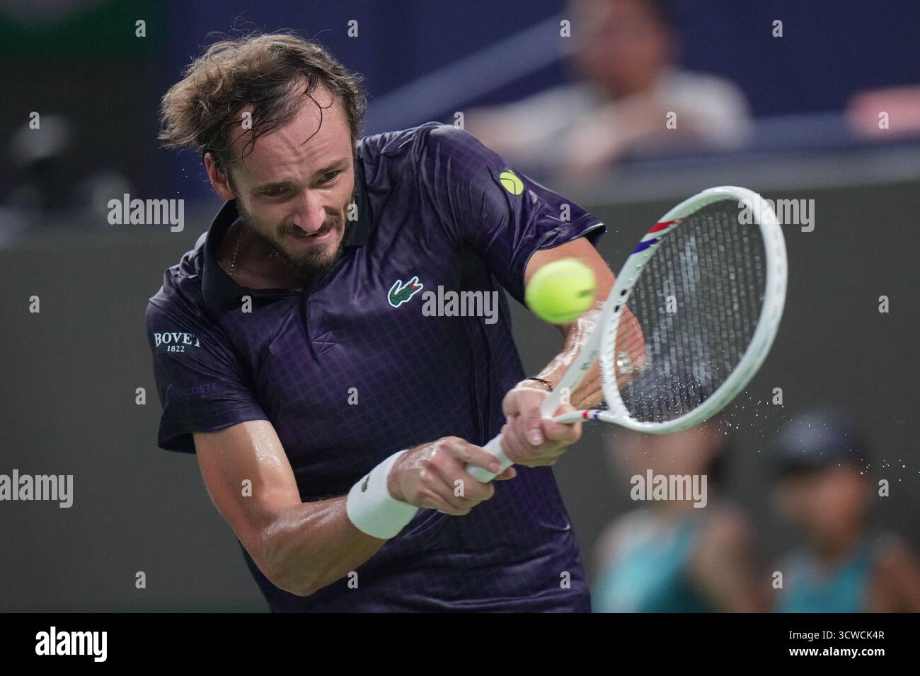 Daniil Medvedev of Russia plays a backhand return to Arthur Rinderknech ...
