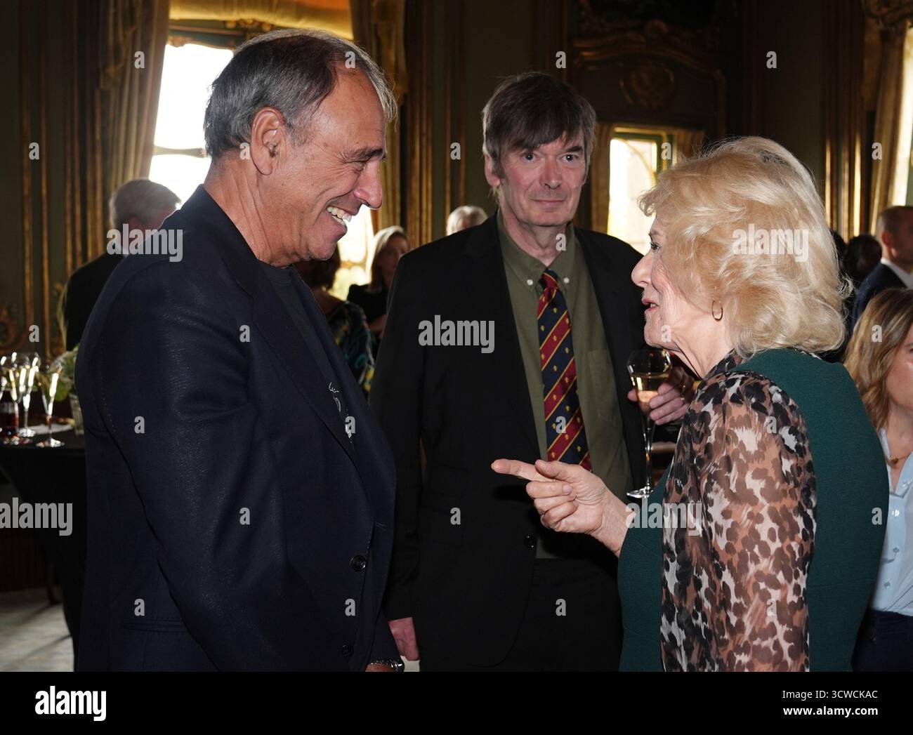 Britain's Queen Camilla speaks with Anthony Horowitz, left, and Ian ...