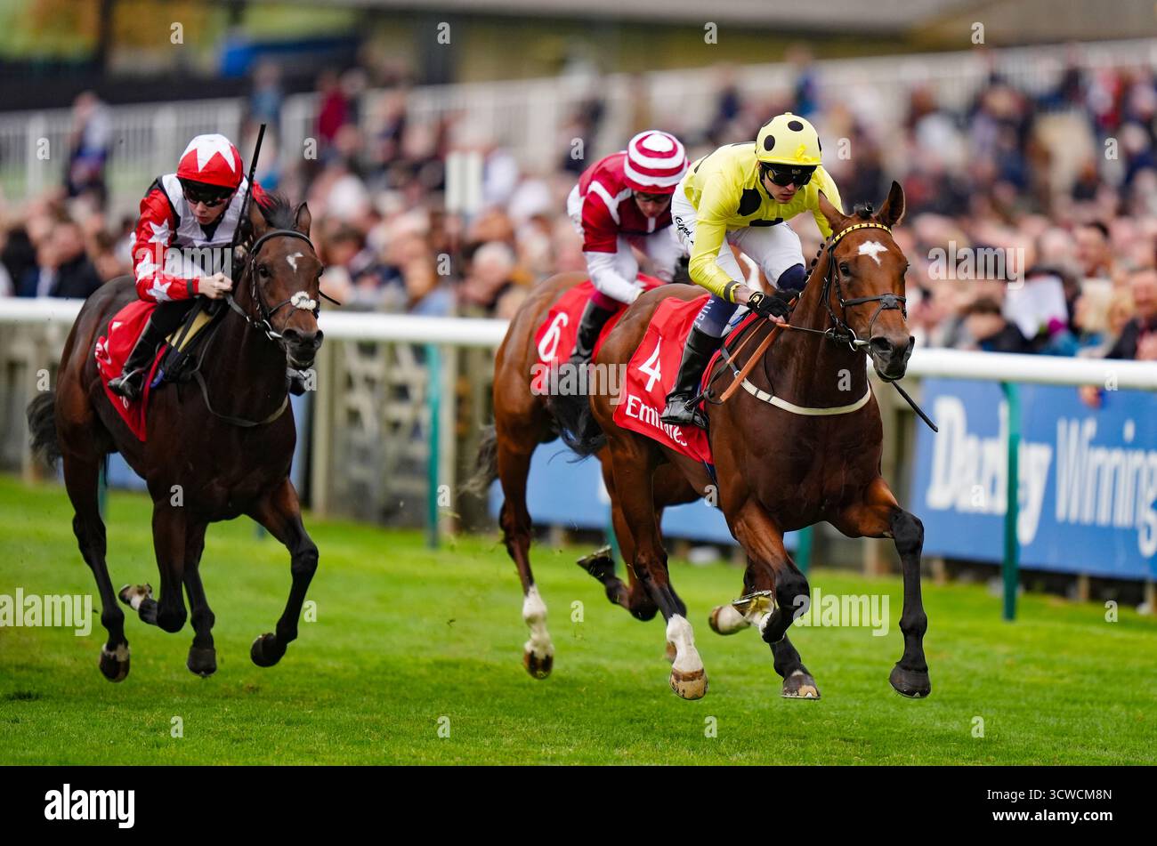Hankelow ridden by Clifford Lee (right) wins the Emirates Autumn Stakes ...