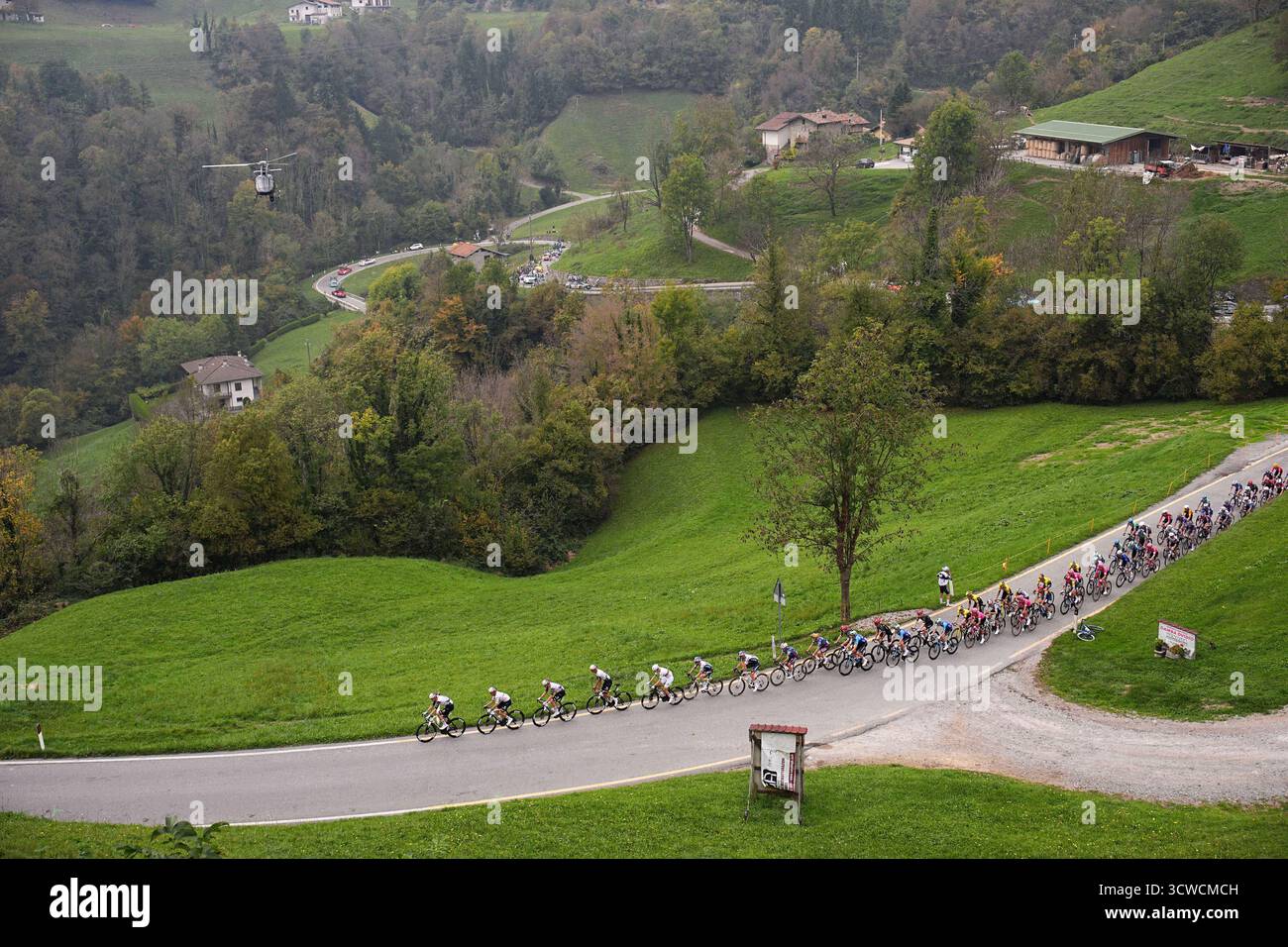 The pack rides through the countryside during Il Lombardia, Tour of ...