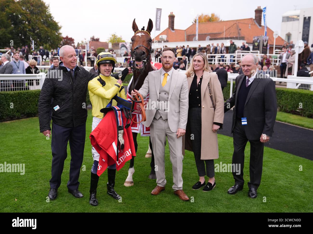 Trainer Karl Burke (left) and Jockey Clifford Lee (second left) with ...