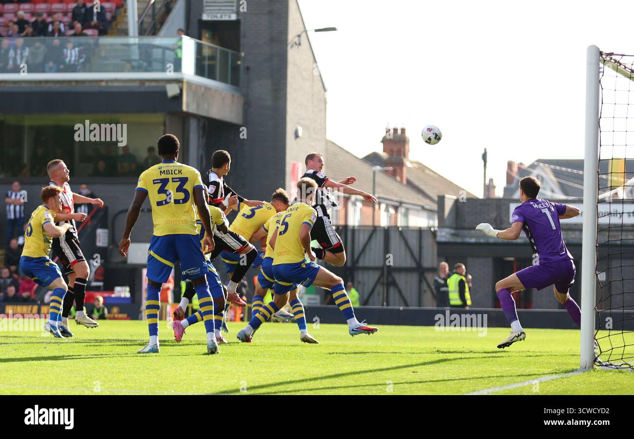 Grimsby Town's Kieran Green (second right) scores his sides first goal ...