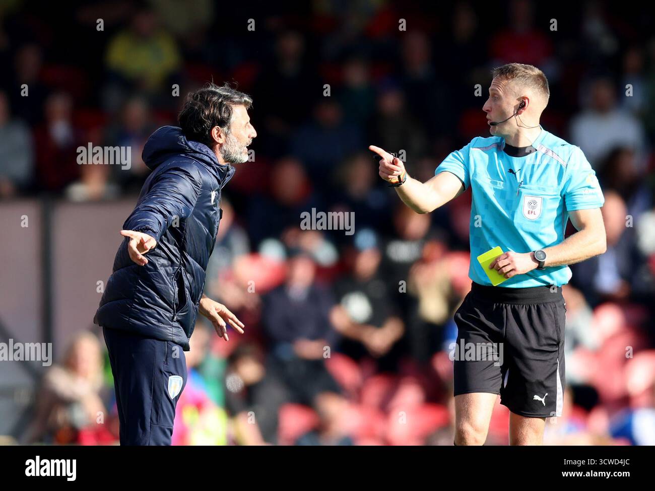 Colchester United manager Danny Cowley (left) after being shown a ...