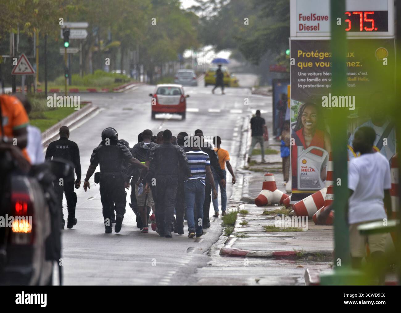 Police arrest a protester during clashes with opposition supporters in ...