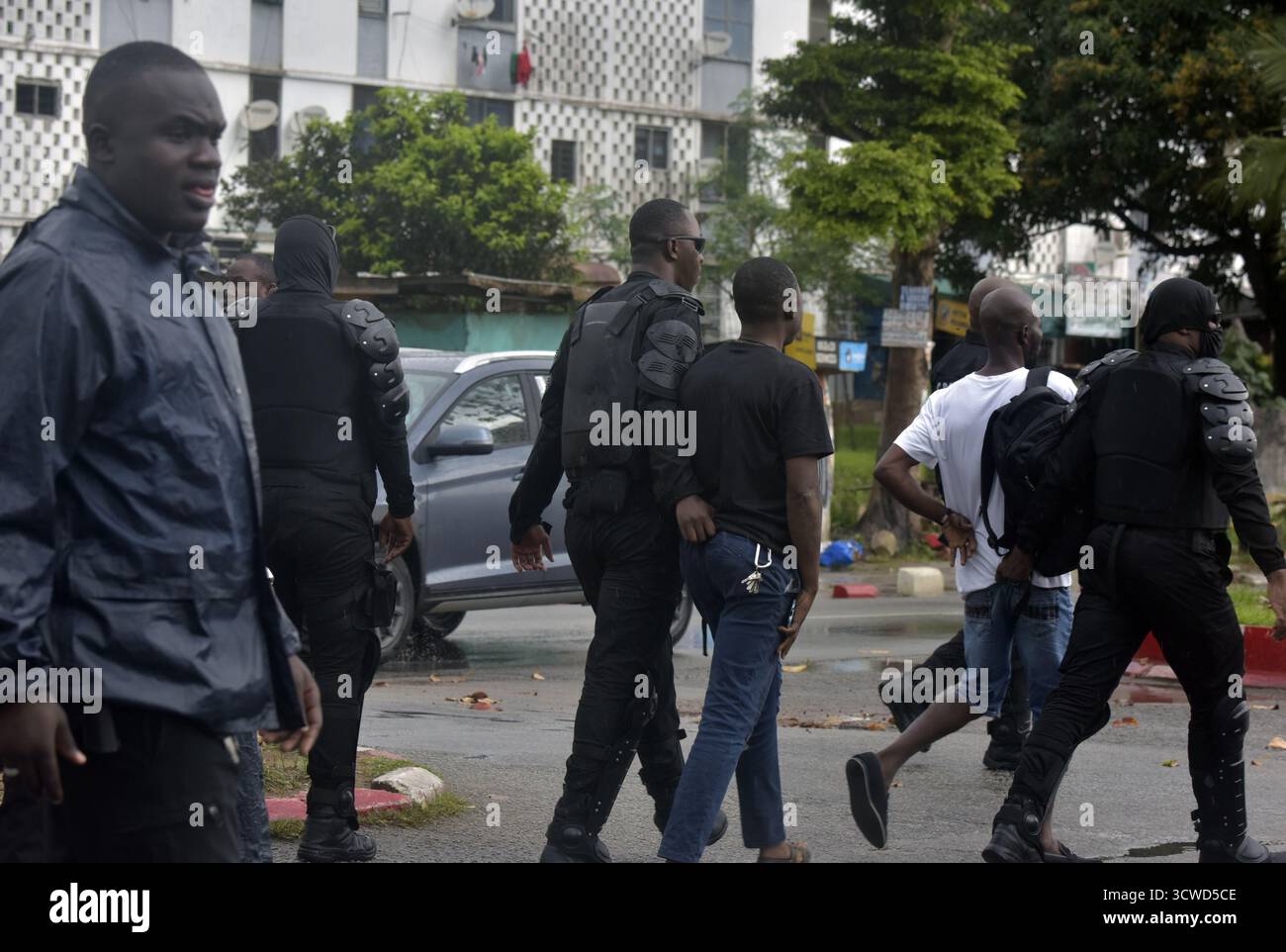 Police arrest a protester during clashes with opposition supporters in ...
