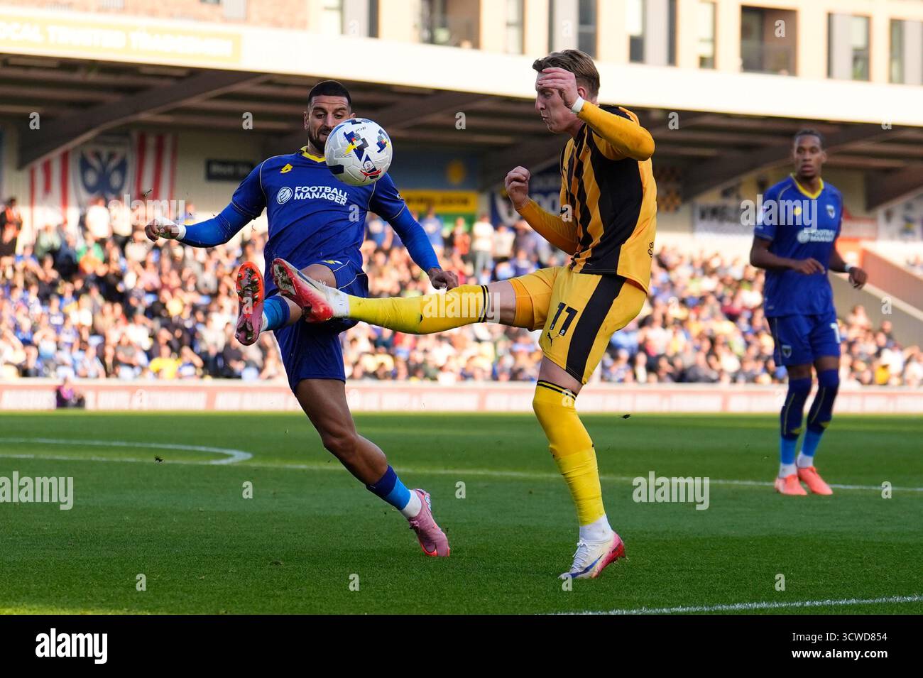 AFC Wimbledon's Omar Bugiel (left) and Port Vale's Ronan Curtis battle ...