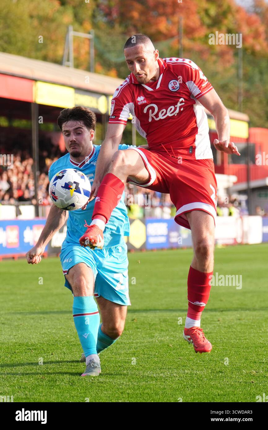 Walsall's Jamie Jellis (left) and Crawley Town's Ryan Loft battle for the ball during the Sky ...