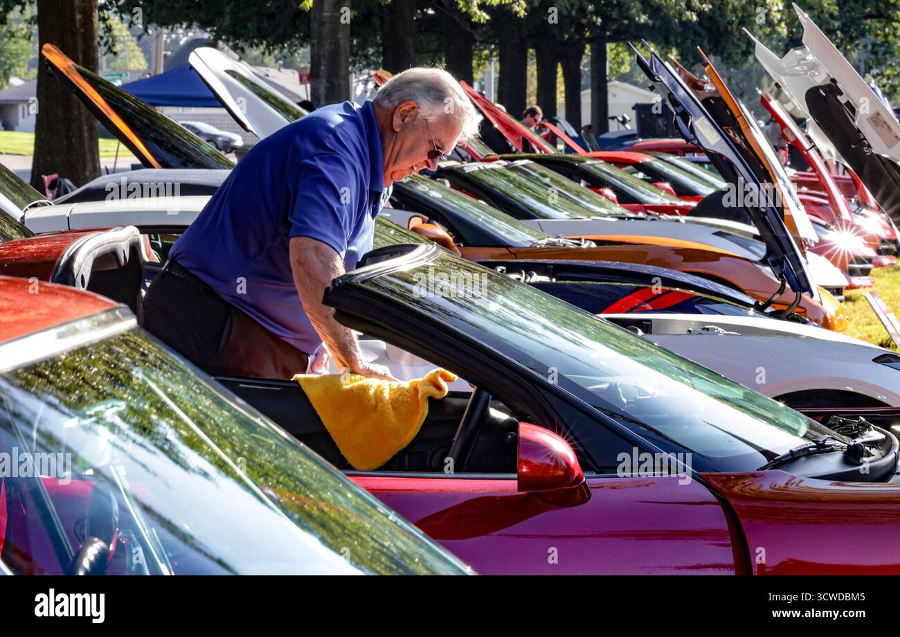 Gene Vanover wipes dust off his 2002 Chevy Corvette C5 while showing it ...