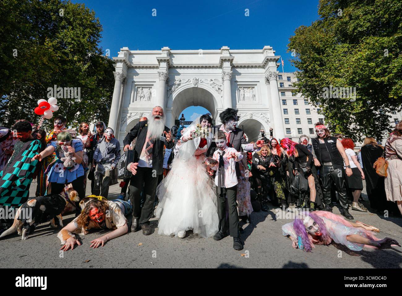 London, UK. 11th Oct, 2025. The zombies line up for a group shot at ...