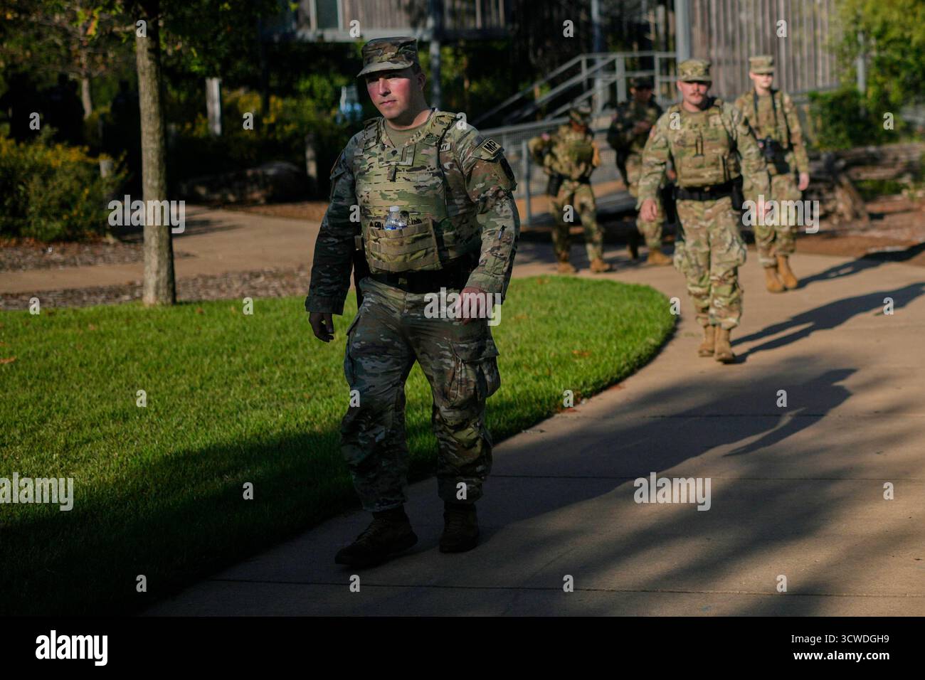 Members of the National Guard patrol a park along the Mississippi River ...