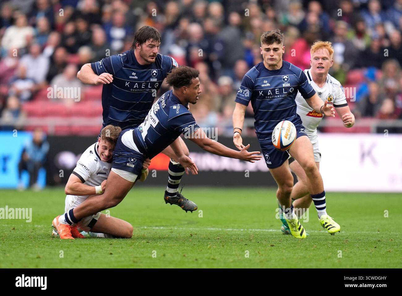Bristol Bears' Gabriel Oghre offloads the ball after being tackled by ...