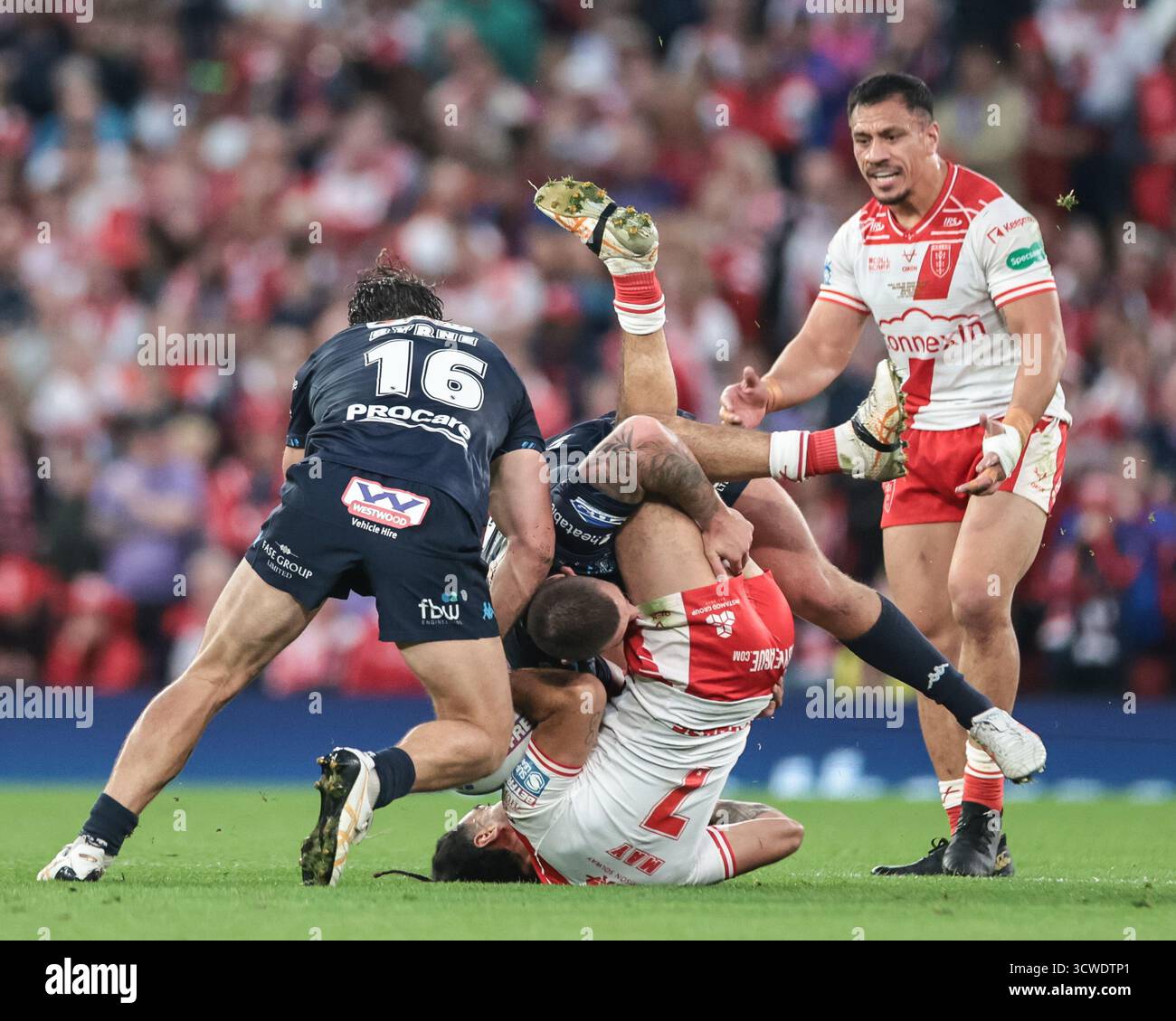 Tyrone May of Hull KR receives a heavy tackle off Brad O'neill of Wigan ...