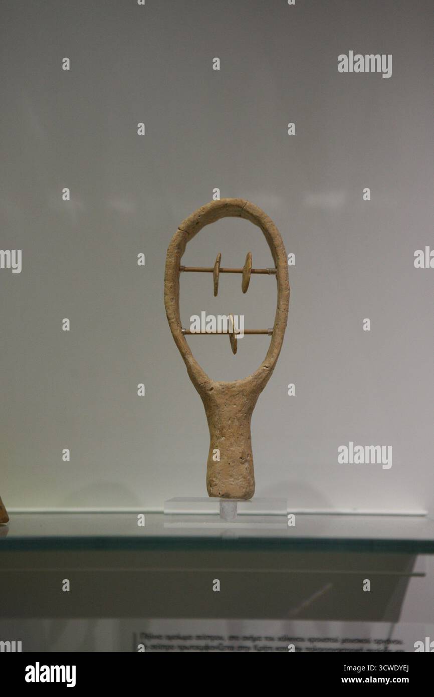 Clay sistrum -model of a bronze percussion instrument. Found Archanes ...