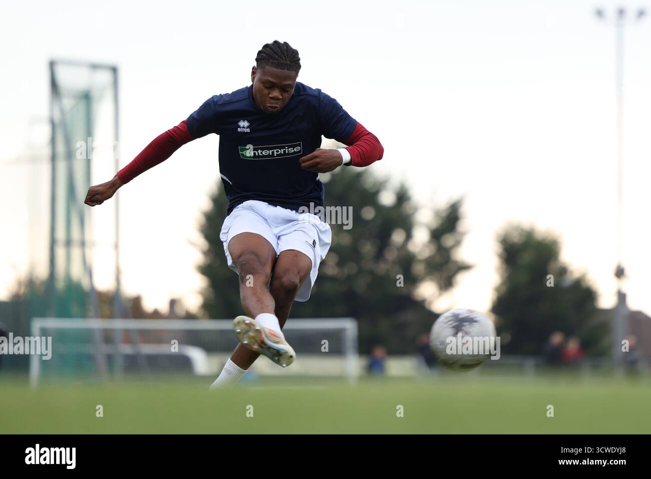 Sam Folarin, of Chelmsford City, warming up before the match between ...