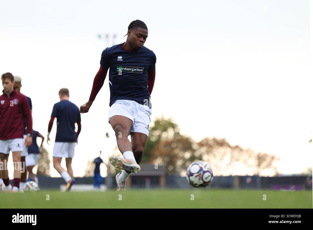 Sam Folarin, of Chelmsford City, warming up before the match between ...