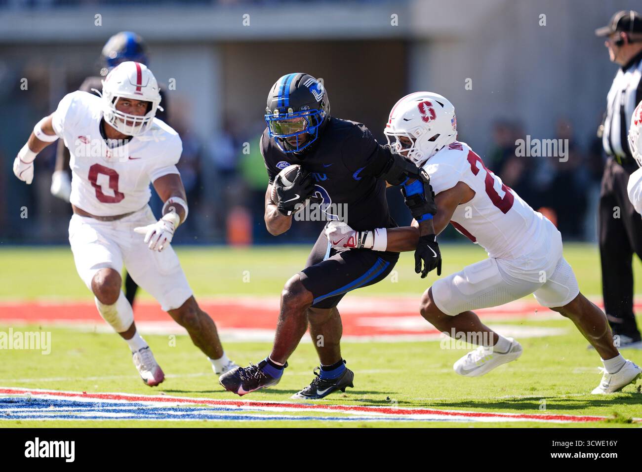 SMU wide receiver Jordan Hudson (2) attempts to escape the grasp of ...