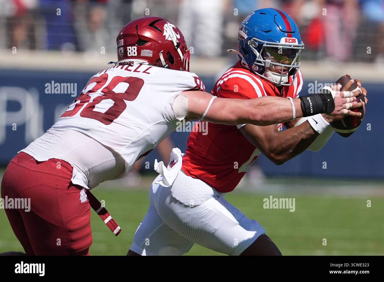 Mississippi quarterback Trinidad Chambliss (6) is sacked by Washington ...