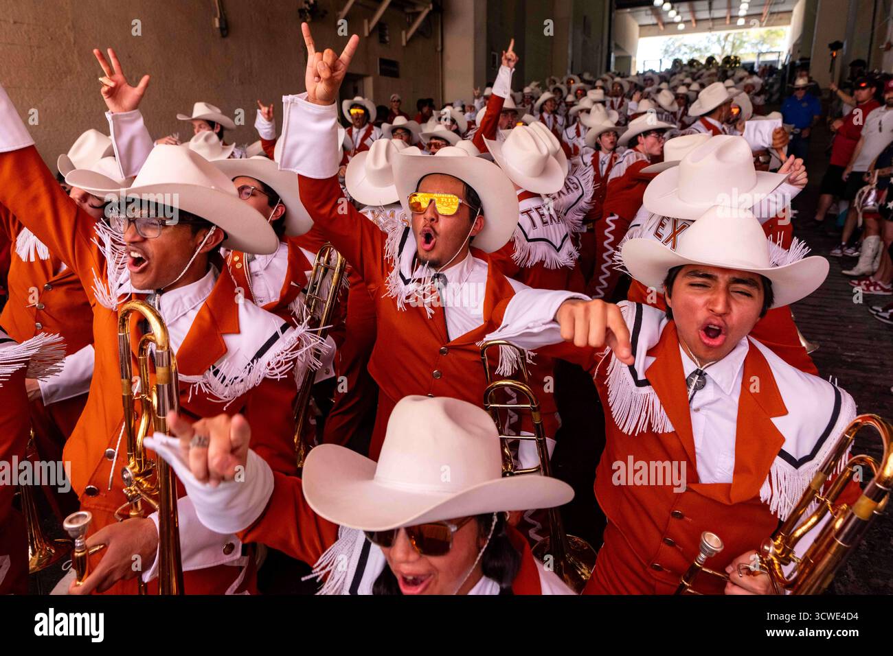 The Texas band cheers in the tunnel before taking the field before an ...