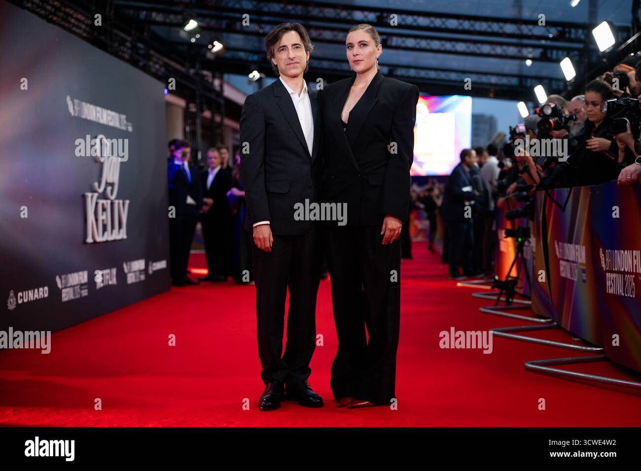 Director Noah Baumbach, left, and Greta Gerwig pose for photographers ...