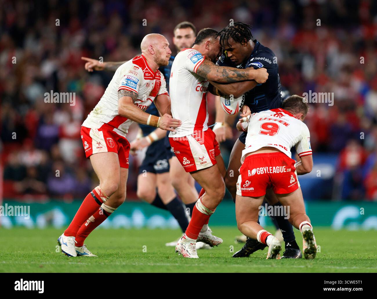 Wigan Warriors' Junior Nsemba is tackled during the Betfred Super ...