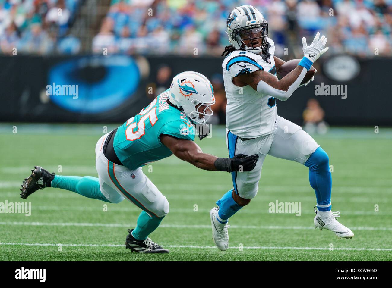 Miami Dolphins linebacker Tyrel Dodson (25) tries to tackle Carolina ...