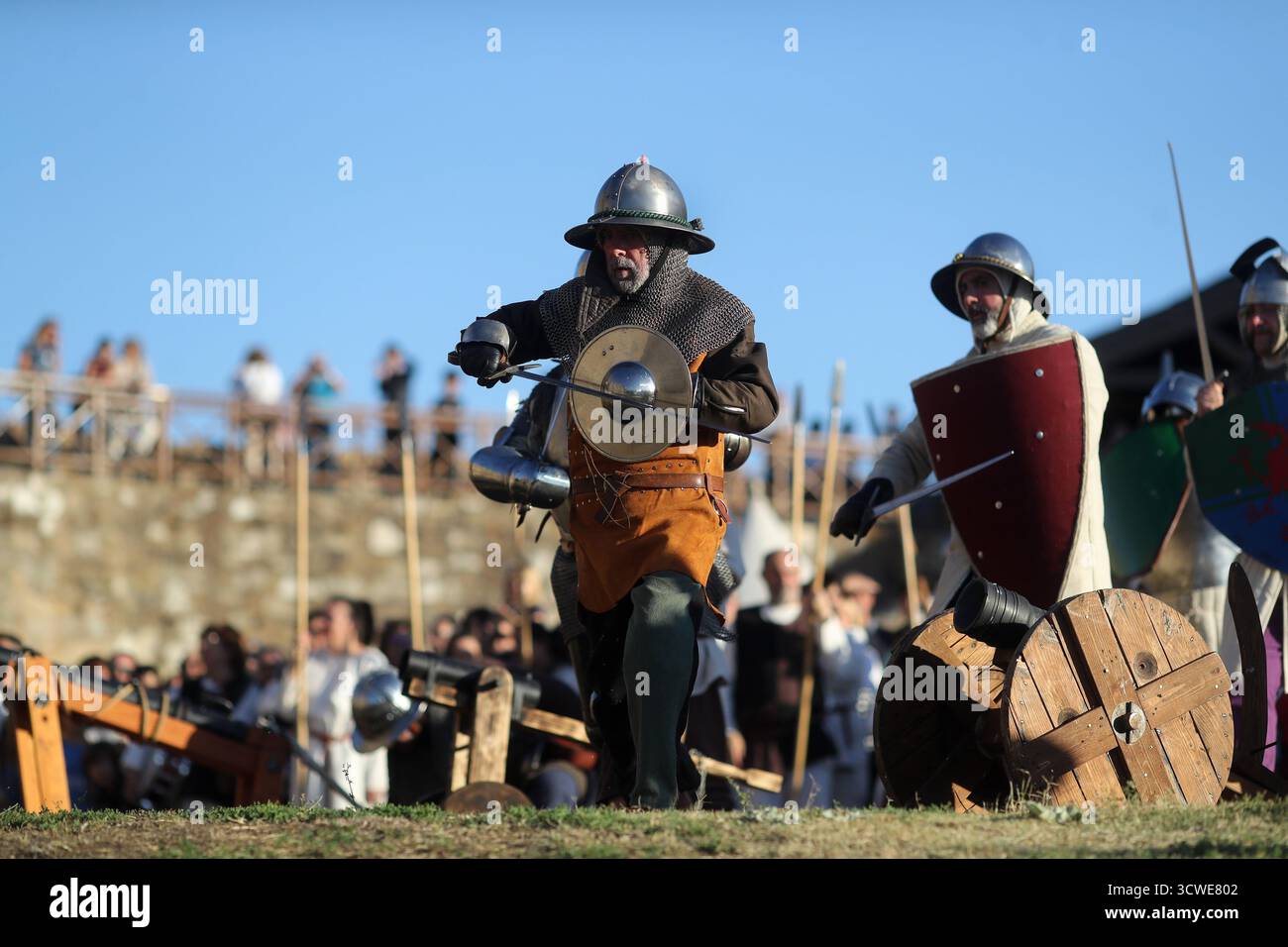 Several people in medieval costumes during the seventh edition of the ...