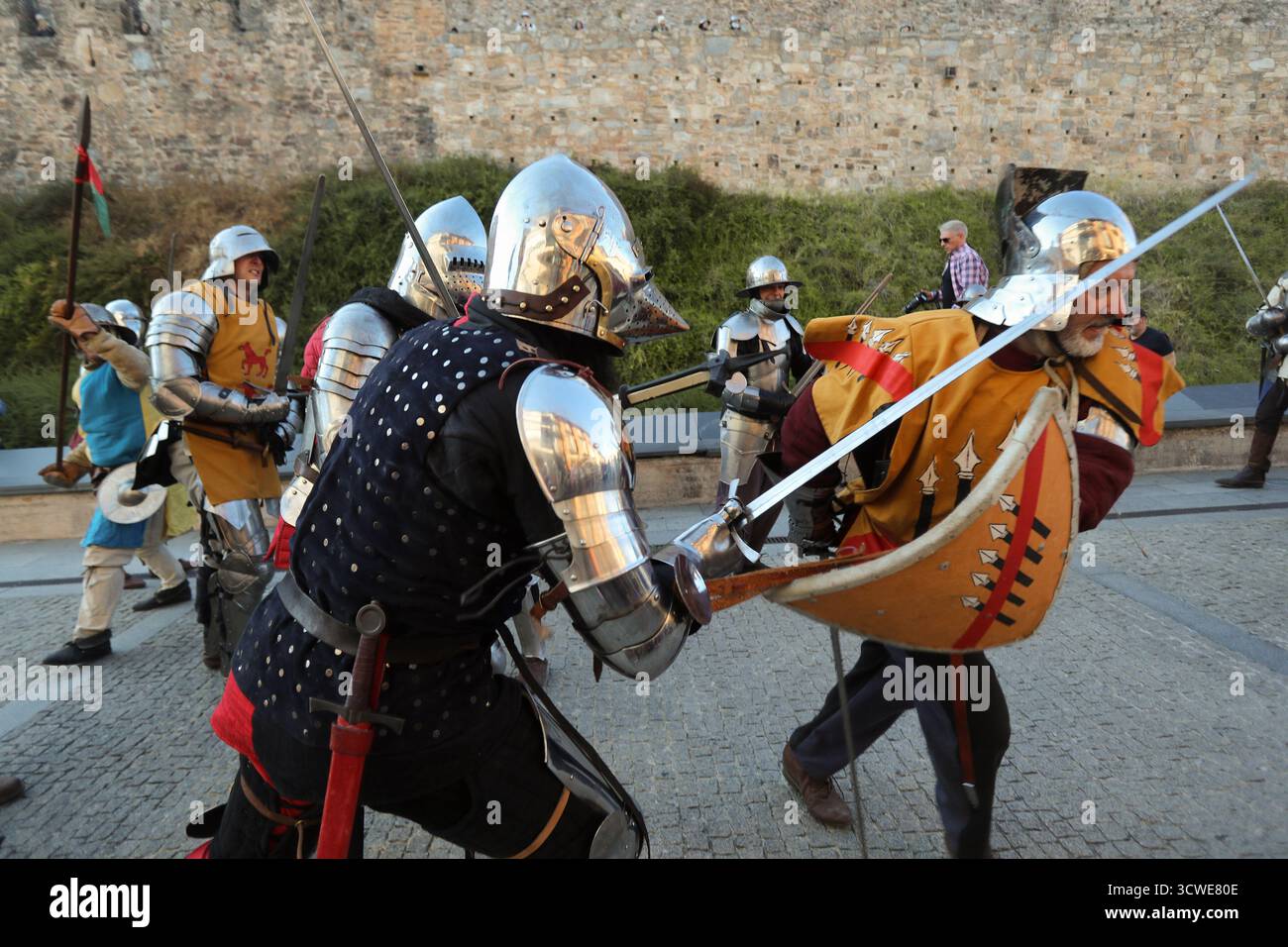 Several people in medieval costumes during the seventh edition of the ...