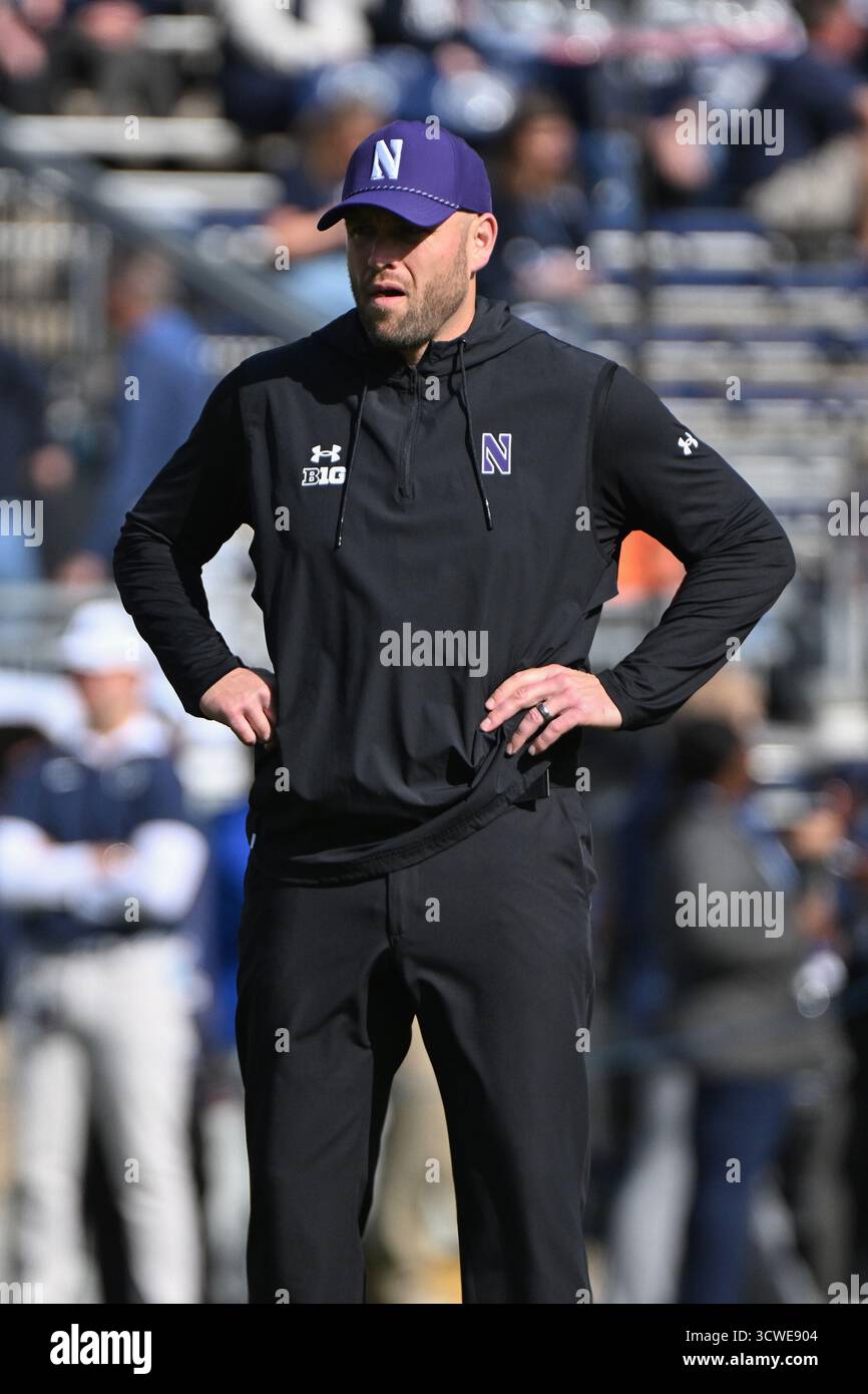 Northwestern head coach David Braun watches warm up for an NCAA college ...
