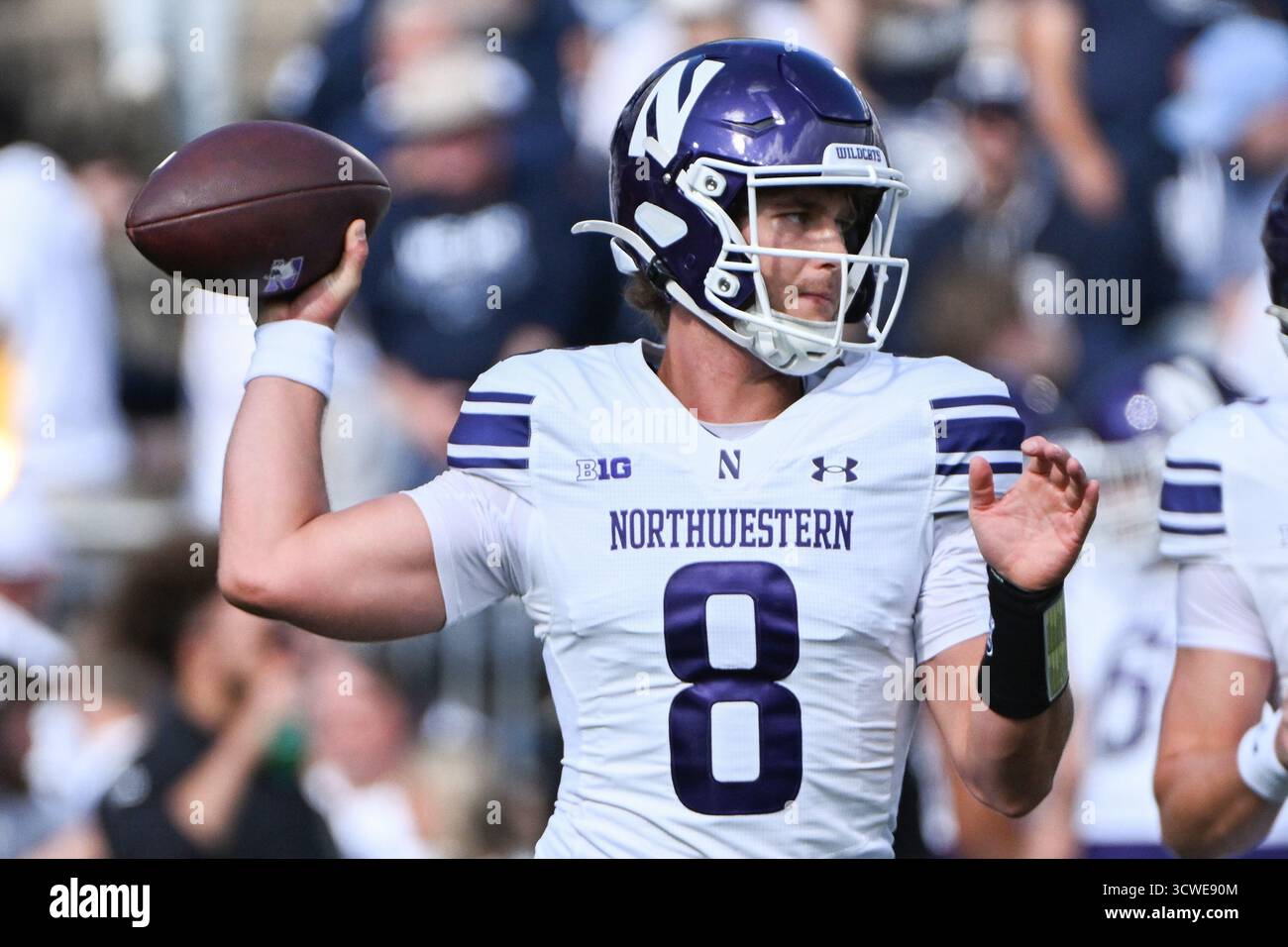 Northwestern quarterback Preston Stone (8) warms up for an NCAA college ...