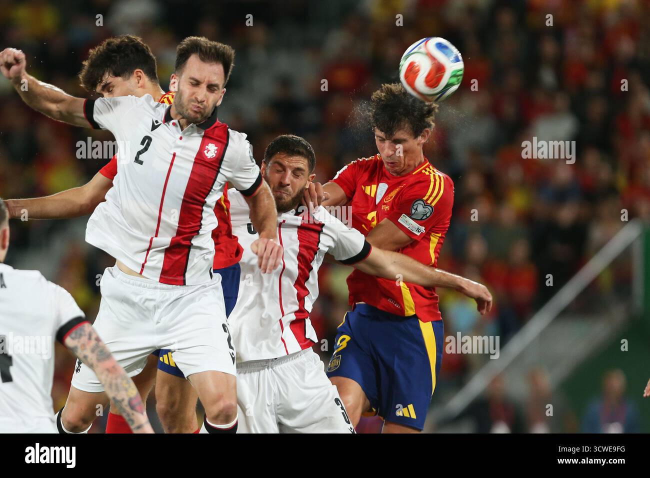 Spain's Robin Le Normand, right, heads the ball on goal during a World ...