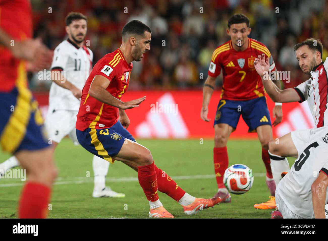 Spain's Mikel Merino, left, attempts a shot on goal during a World Cup ...