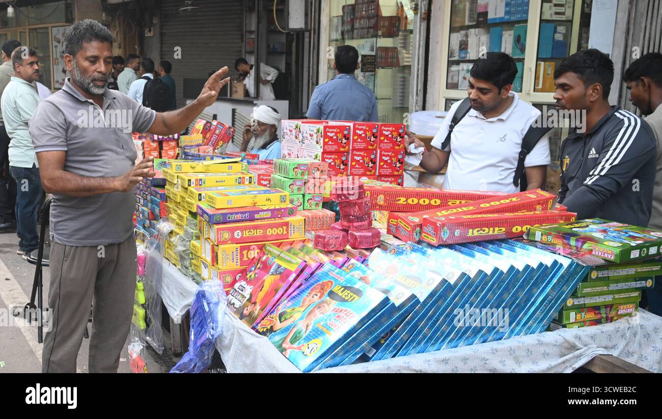 NEW DELHI, INDIA - OCTOBER 11: People selling green firecrackers at ...