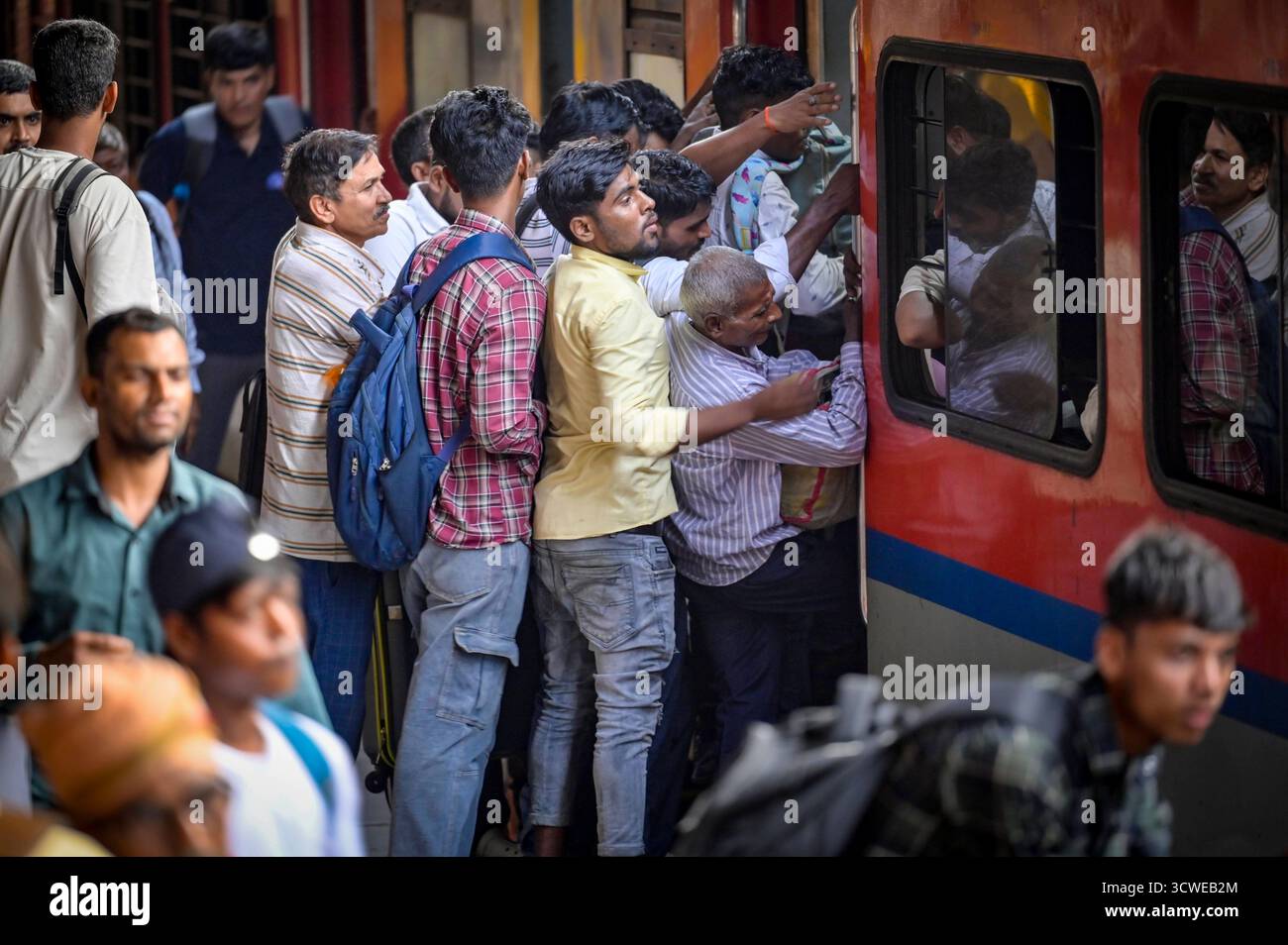 NEW DELHI, INDIA - OCTOBER 11: A view of crowd of passengers struggling ...
