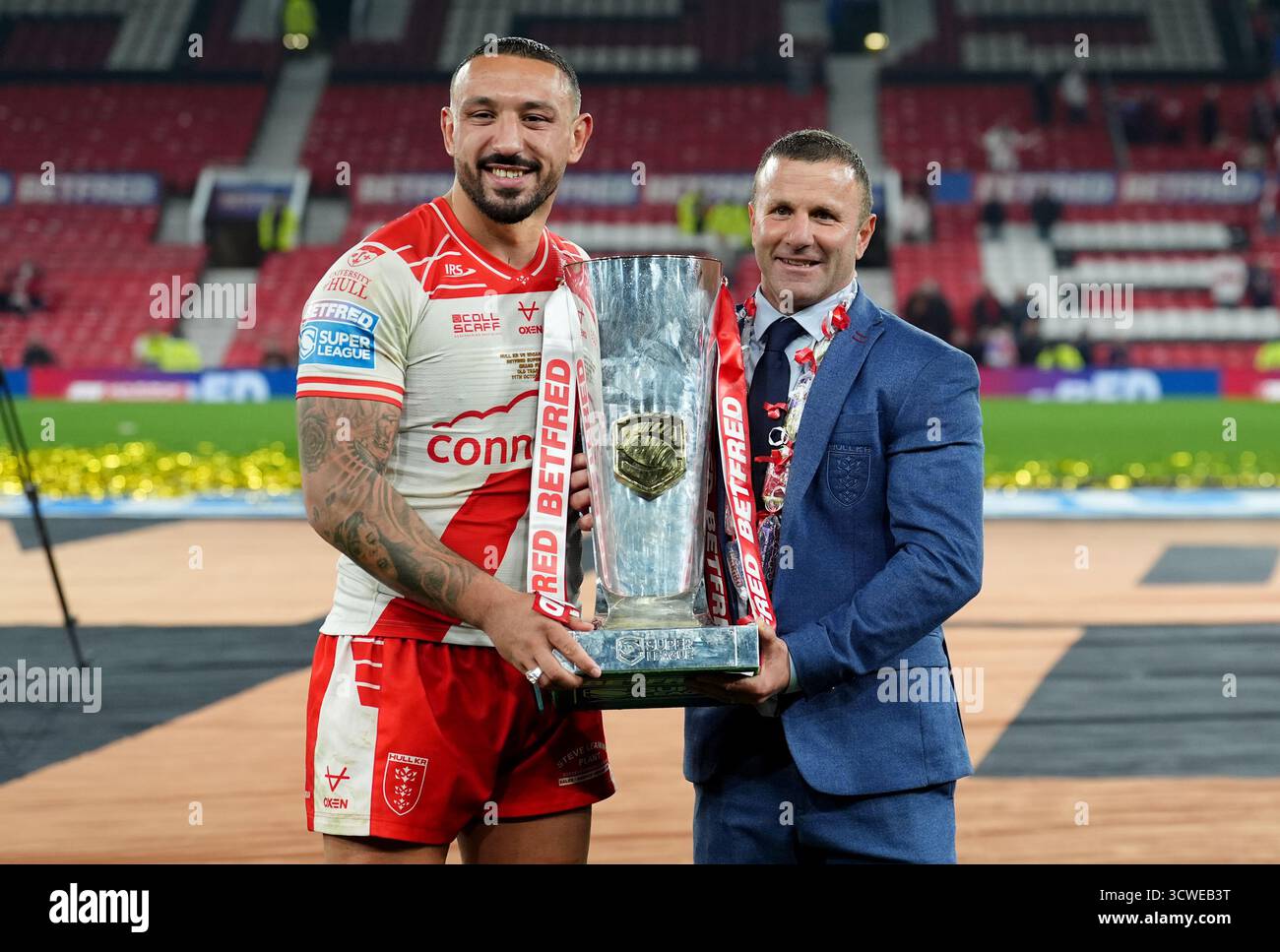 Hull KR's Elliot Minchella (left) with the trophy and Hull KR head ...